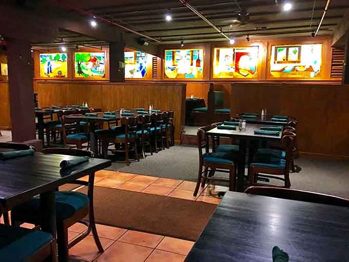 Those colorful stained glass panels aren't just pretty&mdash;they're watching you devour ribs like there's no tomorrow, no judgment.