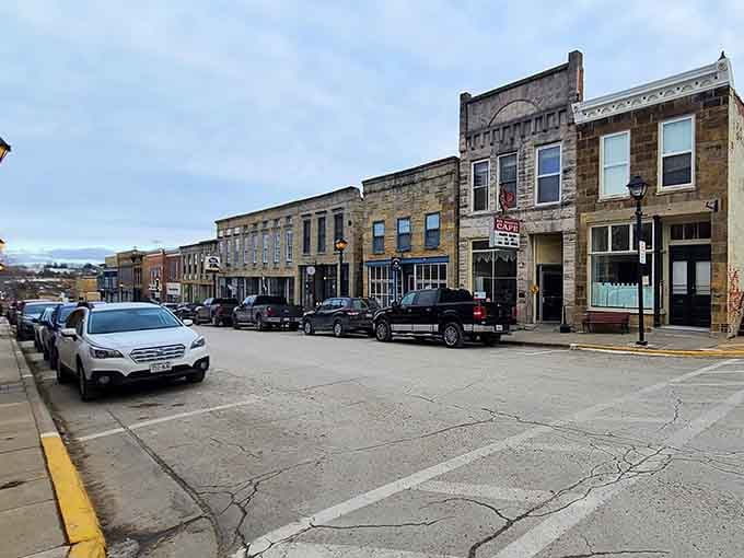 This downtown streetscape proves that historic preservation and actual functioning businesses can absolutely coexist in perfect harmony.