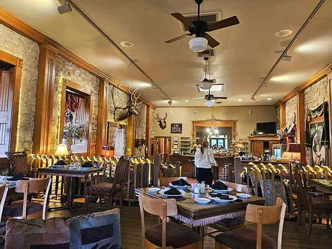 Step inside where exposed brick meets mounted game, creating an atmosphere that's equal parts saloon and sophisticated dining room.