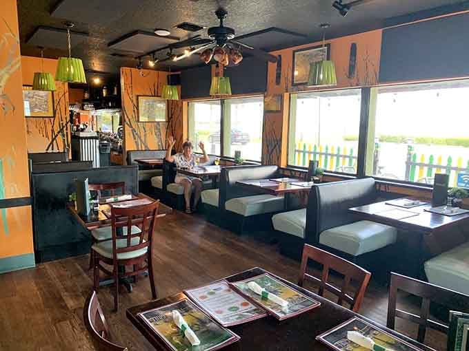 Cozy booths, warm lighting, and island vibes create the perfect setting for your whole red snapper adventure.