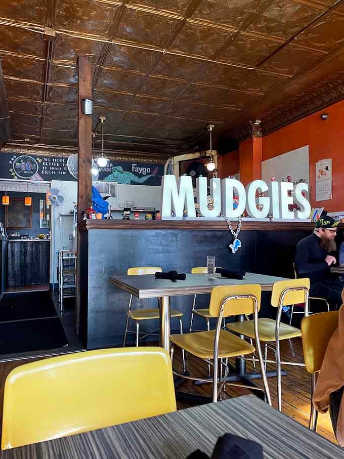 Yellow chairs and tin ceilings create the perfect backdrop for life-changing sandwich decisions you're about to make.
