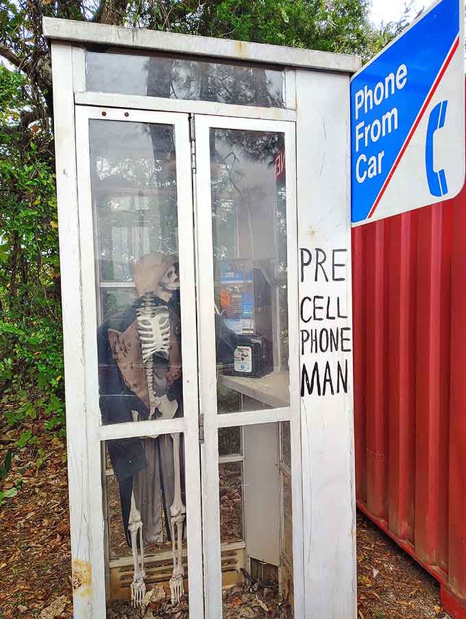 The "Pre Cell Phone Man" display proves that even skeletons had better communication skills before smartphones ruined everything for us.
