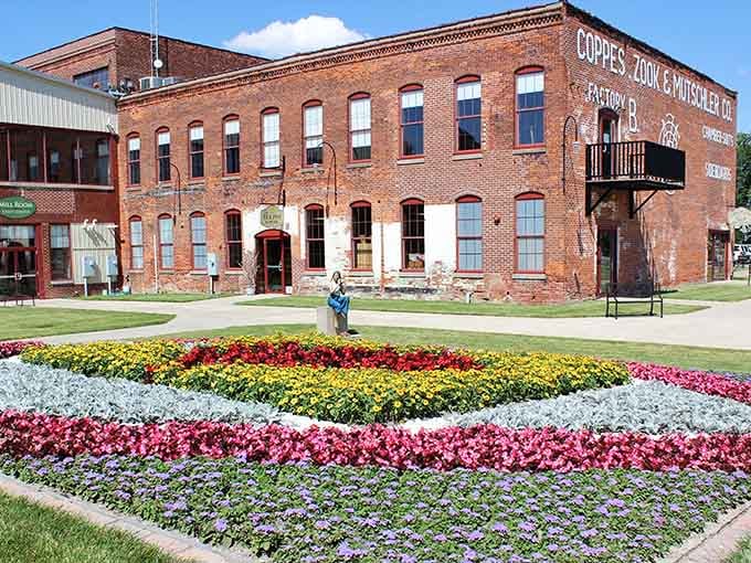 The Coppes Commons building stands proud with its vintage brick facade and colorful flower beds that would make any gardener weep with envy.