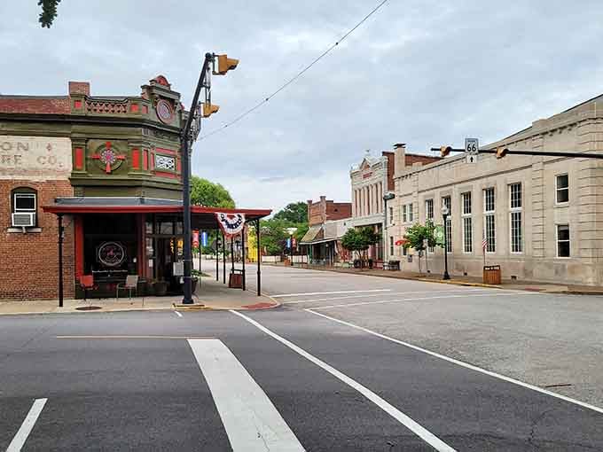 Patriotic bunting decorates storefronts where history and modern life coexist without the usual tourist trap tackiness.