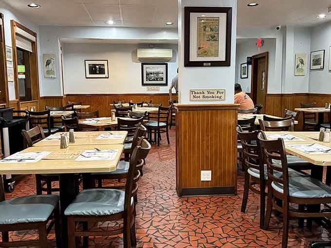 Wood paneling and paper placemats create the perfect no-frills setting for serious eating to happen here.