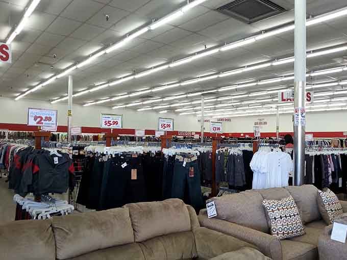 Endless racks of men's clothing stretch toward the horizon like a fabric forest of second chances.