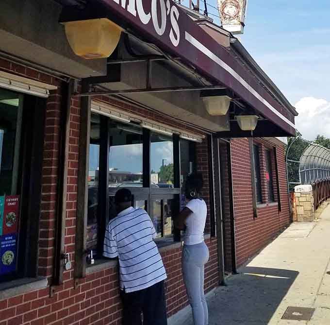 The walk-up window where hot dog dreams come true, one perfectly grilled frank at a time, no reservations required.