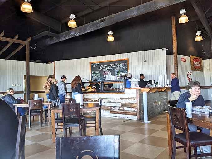 Inside, the no-nonsense charm of checkered floors and wooden tables creates the perfect backdrop for culinary magic to happen.