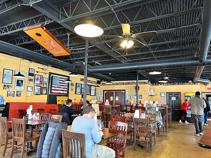 Yellow walls and exposed ductwork create the perfect no-frills setting where smoked meat takes center stage beautifully.