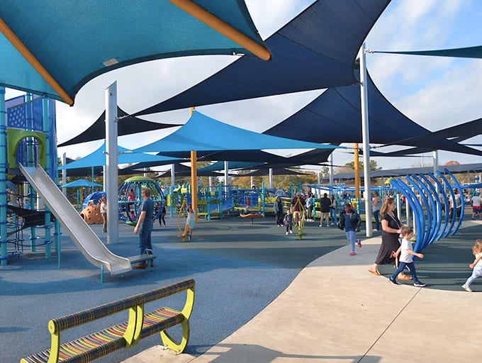 Those shade sails aren't just pretty—they're the difference between happy kids and melted popsicles with legs.