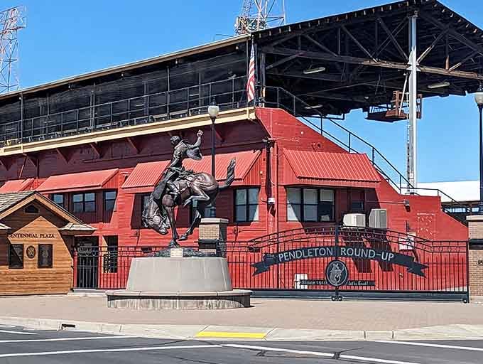 The iconic Pendleton Round-Up grounds stand as a monument to Western heritage, complete with a bronze buckaroo frozen mid-buck for eternity.