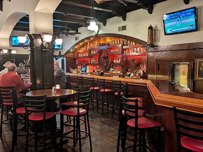Dark wood beams and cozy pub seating create the kind of atmosphere where conversations flow as smoothly as drinks.