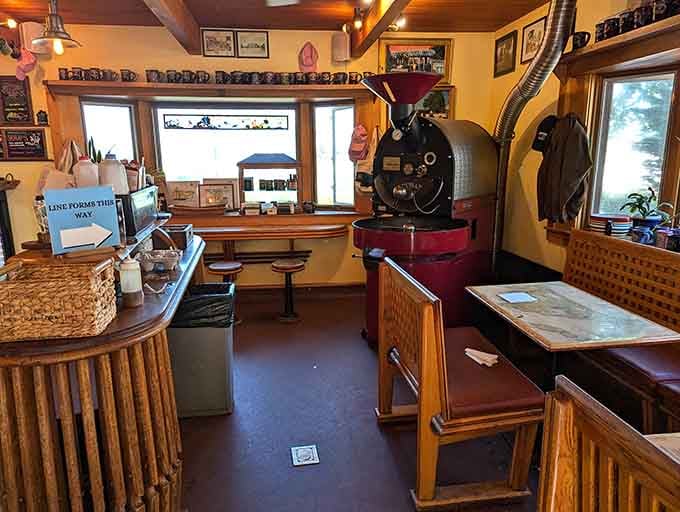 The coffee roaster commands the room like a jazz musician at center stage, turning green beans into liquid gold.