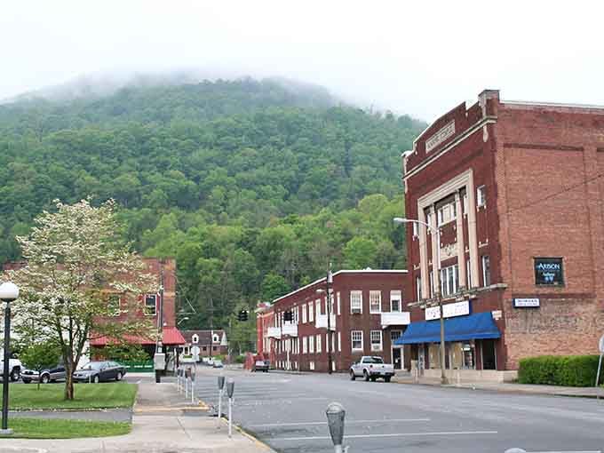 Morning mist hugs the mountains while downtown waits below, ready to welcome you with small-town charm.