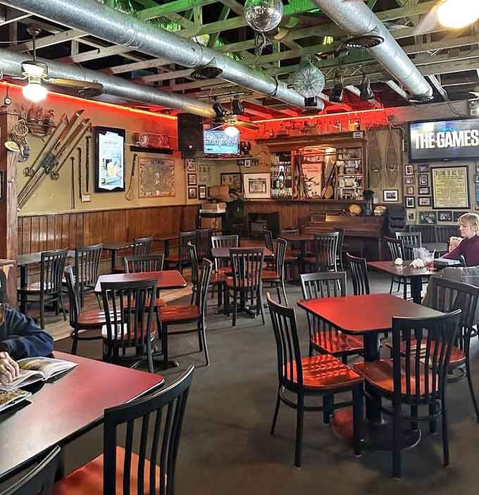 Dark wood, moody lighting, and red accents create the perfect atmosphere for contemplating life over lunch.