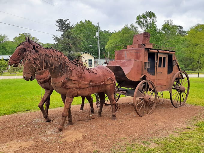 This rusty stagecoach sculpture tells tales of dusty trails and mail deliveries, a metal memory of when "overnight shipping" meant something entirely different.