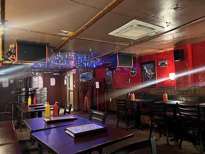 Red walls and Christmas lights create an atmosphere that's part celebration, part controlled chaos, all charm.