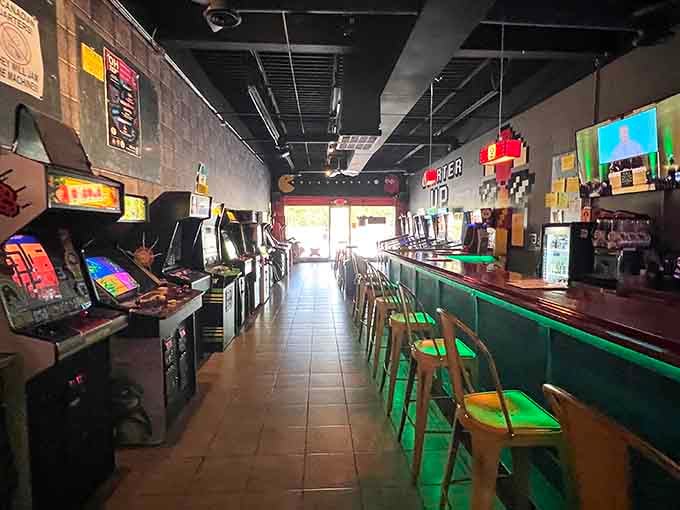 Rows of glowing cabinets line up like old friends waiting to reconnect over cold beer and warm memories.
