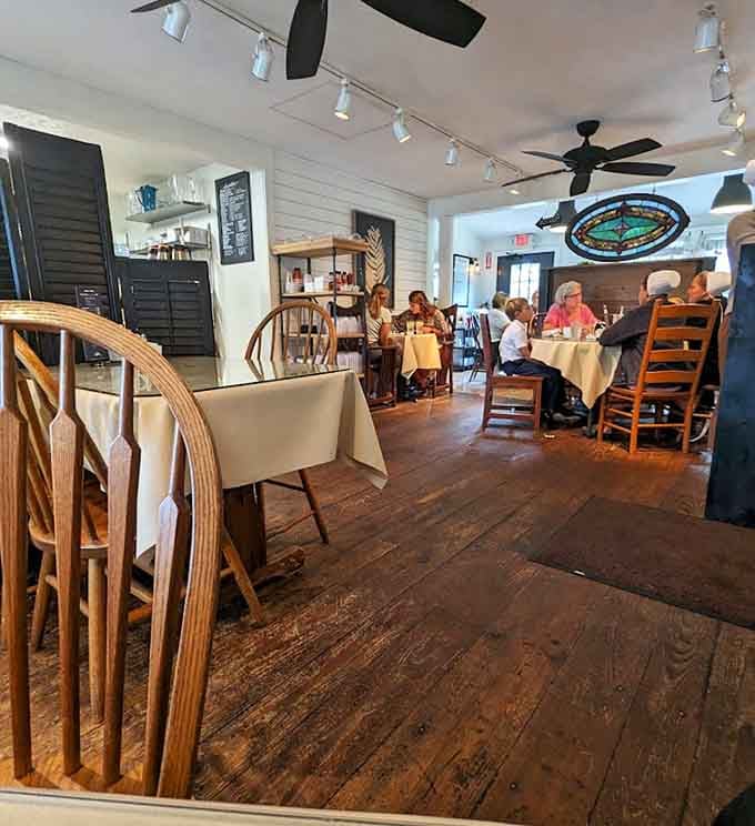 Step inside and discover where rustic charm meets refined dining, complete with white linens and wooden floors that tell stories.