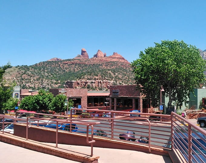 Downtown Sedona framed by red rocks that make every parking lot view feel like a million-dollar vista.
