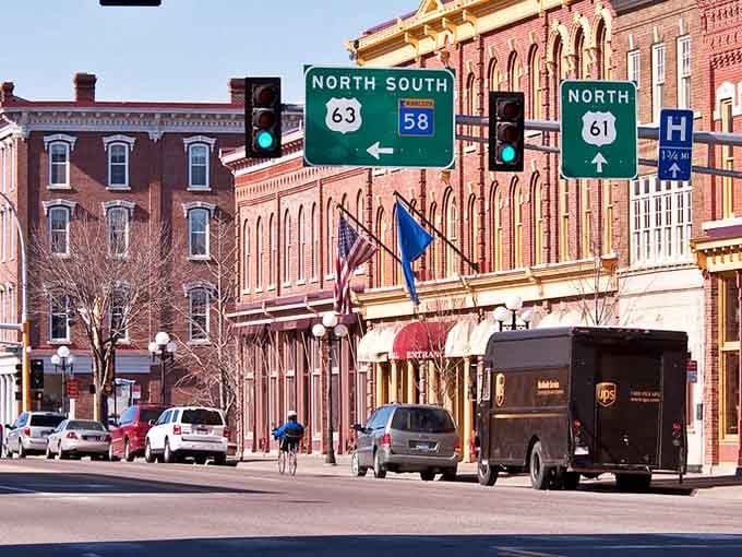 Historic storefronts line up like proud soldiers, their century-old facades refusing to surrender to modern mediocrity.