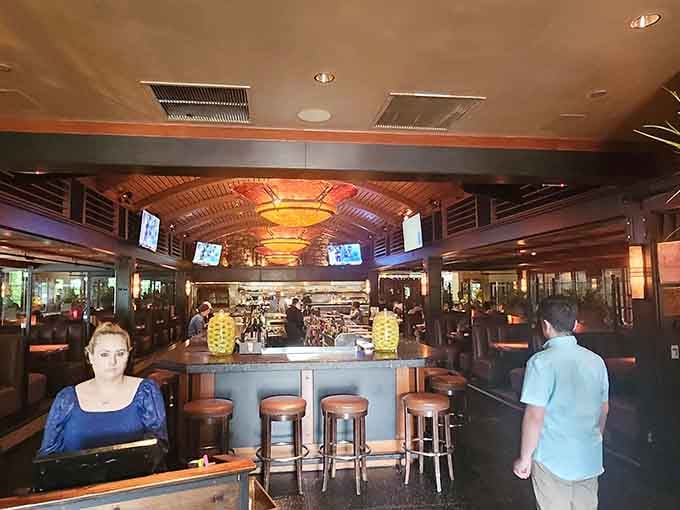 Wood beams, warm lighting, and a bustling bar create the perfect backdrop for a memorable meal.