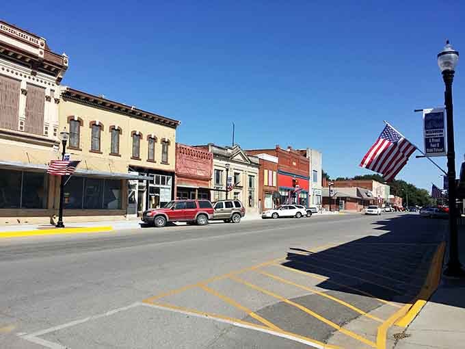 Main Street's historic buildings stand proud, their flags waving like they're welcoming you home for Sunday dinner.