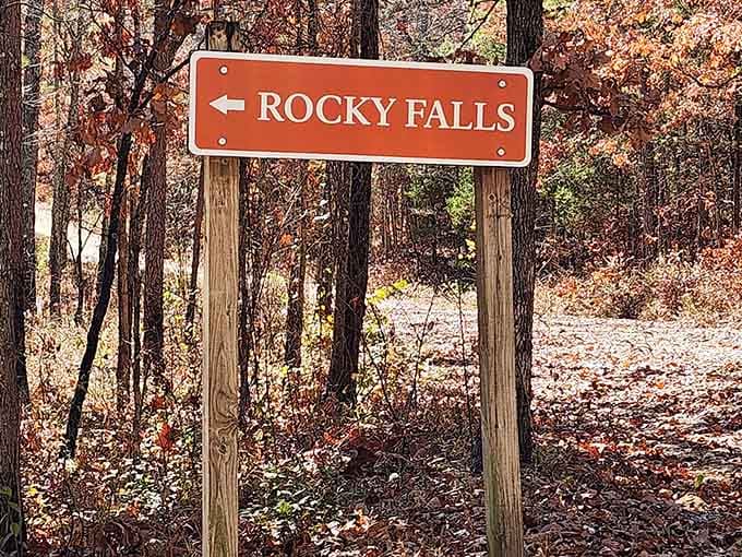 That orange sign pointing left is your golden ticket to Missouri's best-kept aquatic secret.