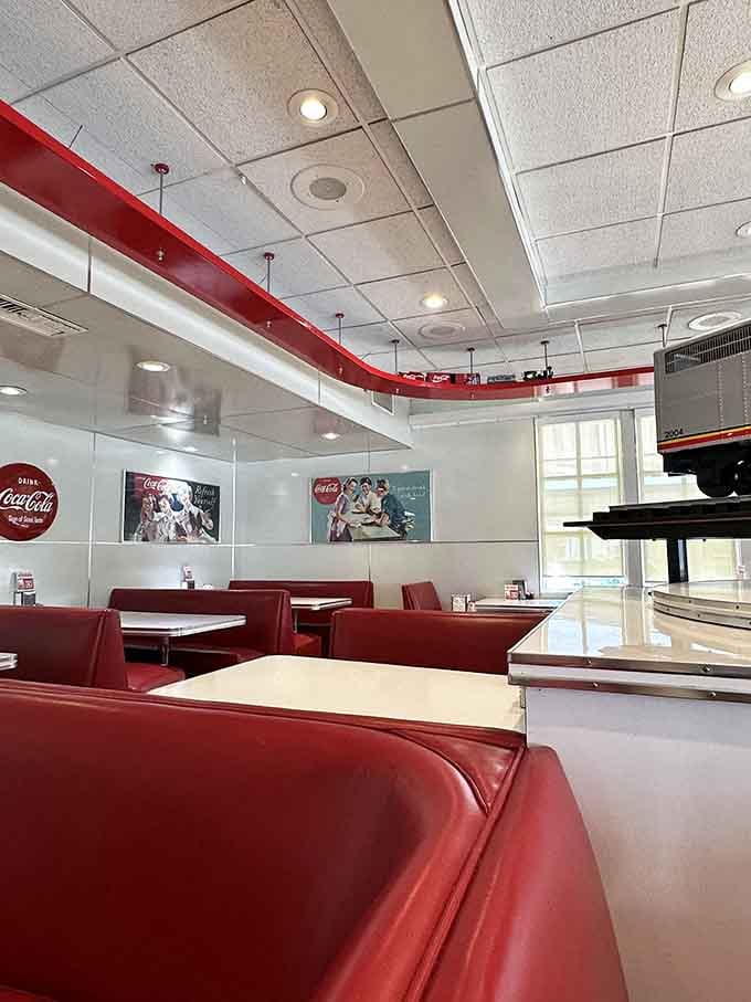 Red vinyl booths and vintage Coca-Cola ads create the perfect setting for your milkshake moment of truth.