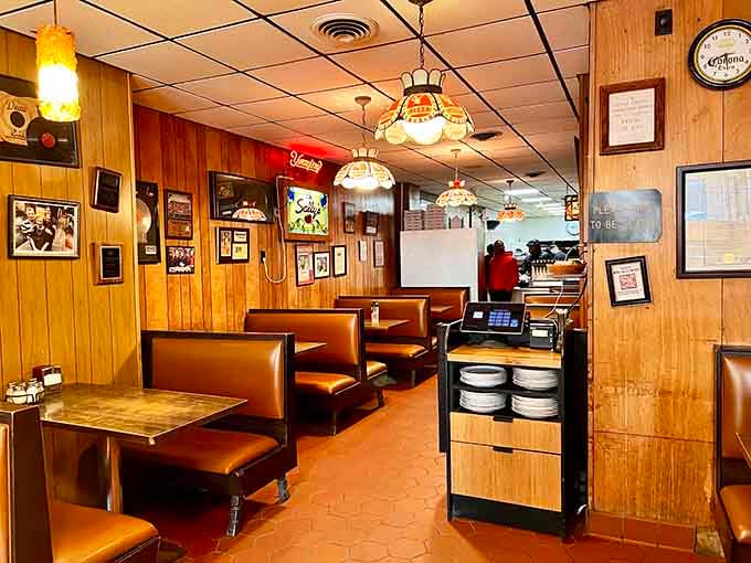 Step inside where wood paneling and vintage booths create the perfect setting for serious pizza consumption.