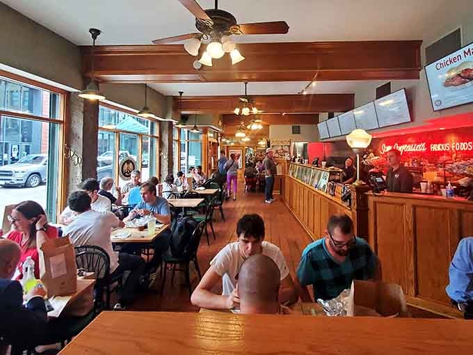 Inside, wooden beams and ceiling fans create the kind of timeless deli atmosphere where business deals and friendships happen.