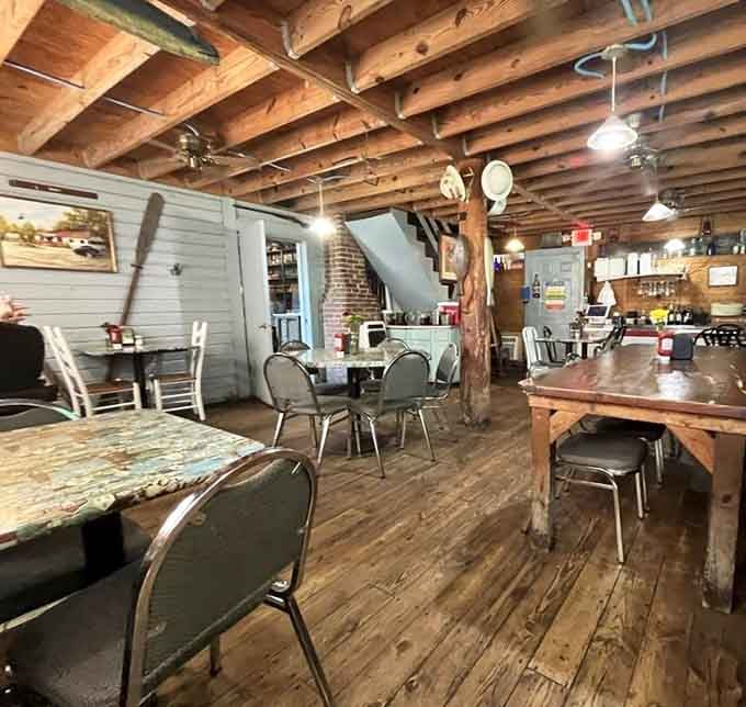 Exposed beams and mismatched tables create the kind of authentic atmosphere you can't fake or buy from a catalog.
