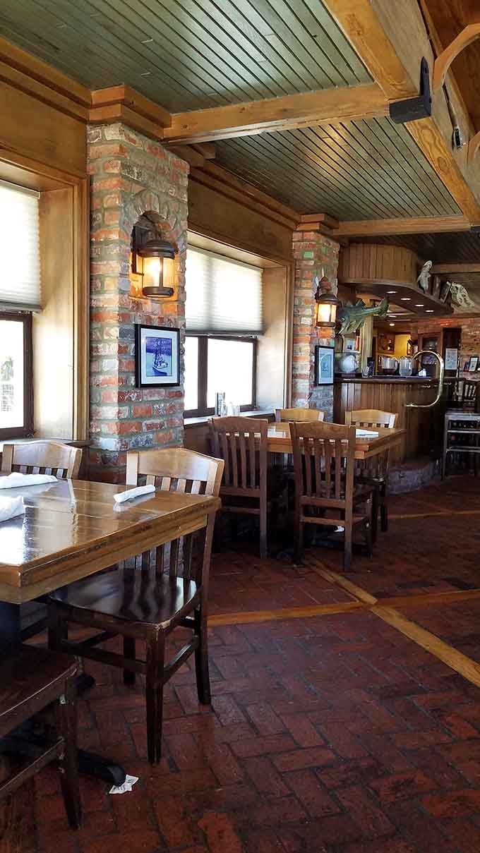 Exposed beams and brick columns create that authentic fish camp vibe without trying too hard to impress.