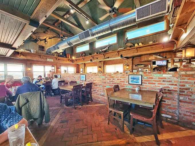 Exposed brick and timber beams create that authentic fish camp vibe you can't fake, only earn through years of service.