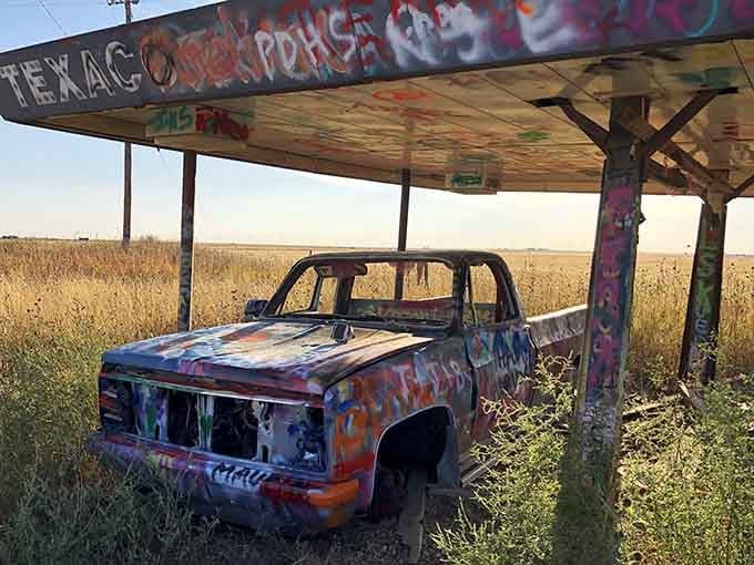Even the old gas station canopy gets the graffiti treatment because nothing escapes the spray paint here, absolutely nothing.