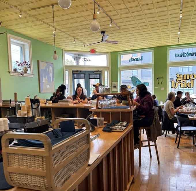 Step inside and those cheerful green walls practically hug you while natural light makes everything look absolutely delicious.