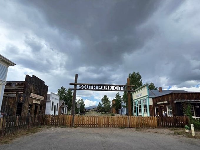 Storm clouds rolling in over authentic frontier buildings? That's just Colorado adding free dramatic atmosphere to your history lesson.