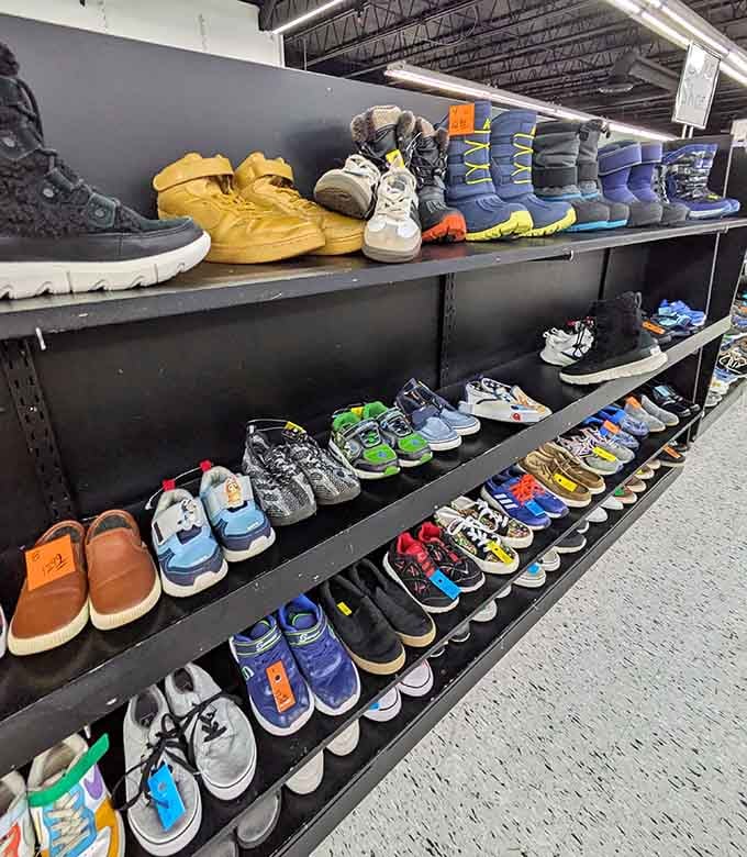 Sneakers lined up like a rainbow of second chances, each pair ready to walk into someone's new story.