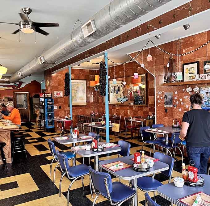Exposed brick, industrial chic, and a checkered floor that screams classic diner with a Southwestern twist.