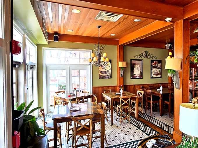 Wood tones, green walls, and checkered floors create a space so inviting you'll forget you have other places to be.