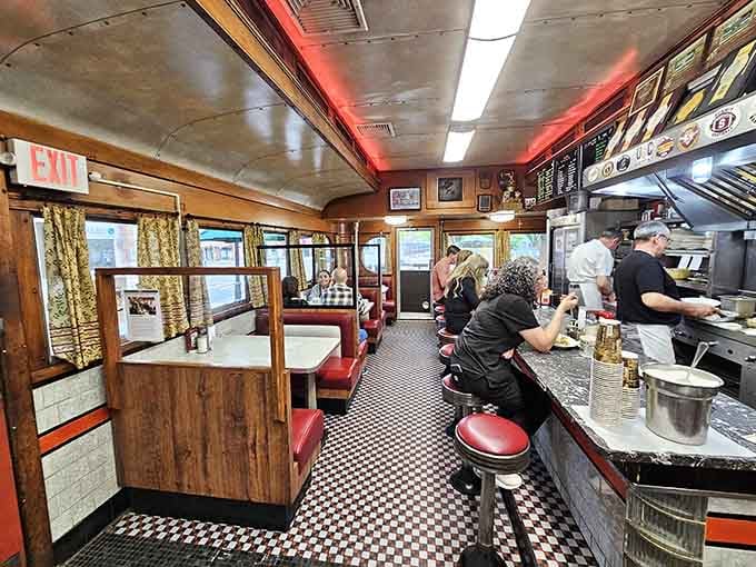 Classic red vinyl booths and checkered floors prove that some design choices are timeless for good reason.