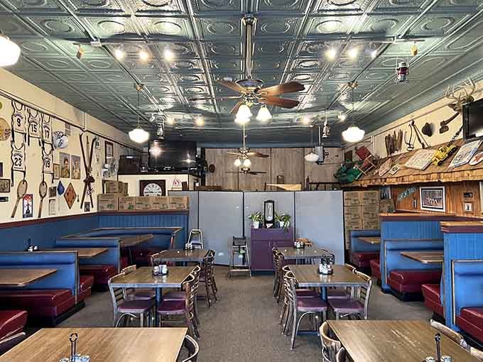 The tin ceiling and blue booths create a retro-diner-meets-Viking-hall vibe that somehow totally works.