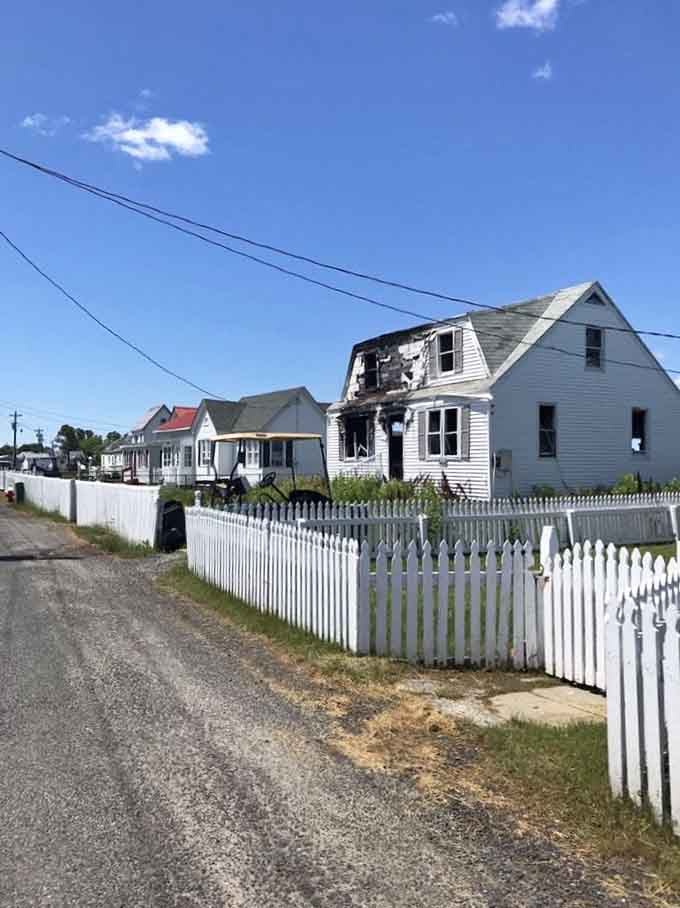 White picket fences and weathered homes line streets so narrow, even Smart Cars would need to suck it in.