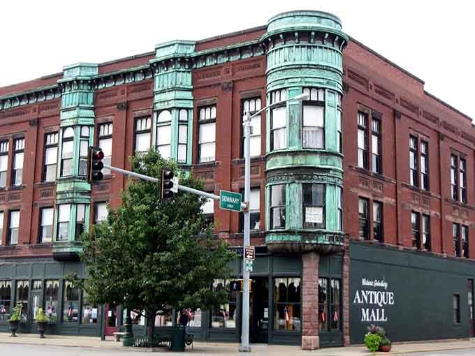 The Galesburg Antique Mall's copper-patinated bay windows catch afternoon light like they were designed for Instagram&mdash;a century before social media existed.