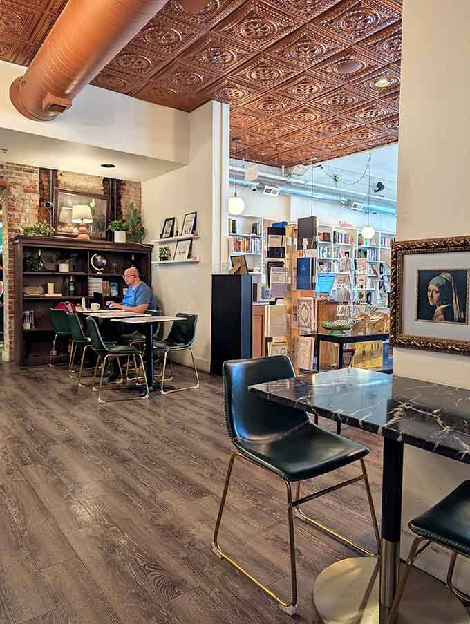 That decorative tin ceiling and exposed brick create the kind of atmosphere where time slows down in the best way.