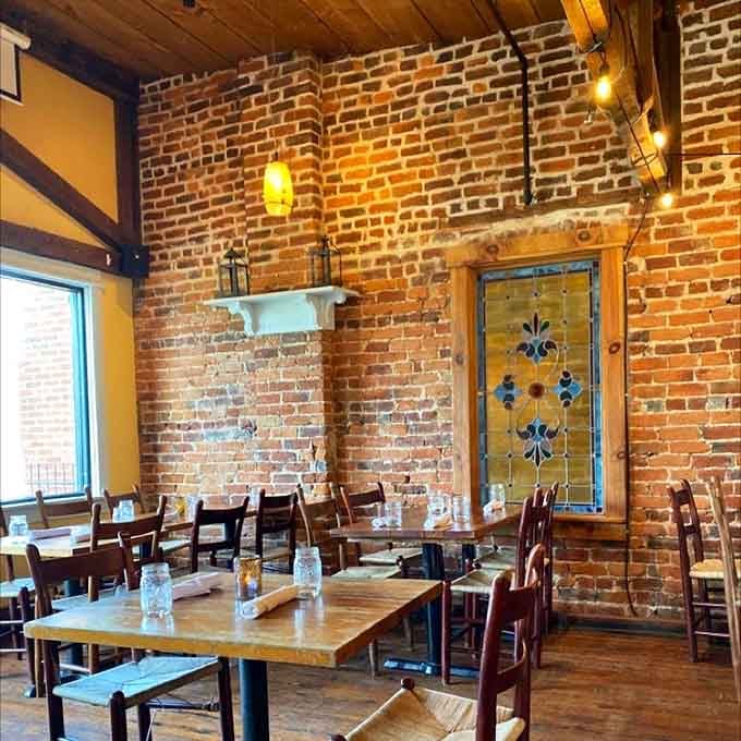 Exposed brick walls and warm lighting create the kind of atmosphere where both first dates and anniversaries feel right.