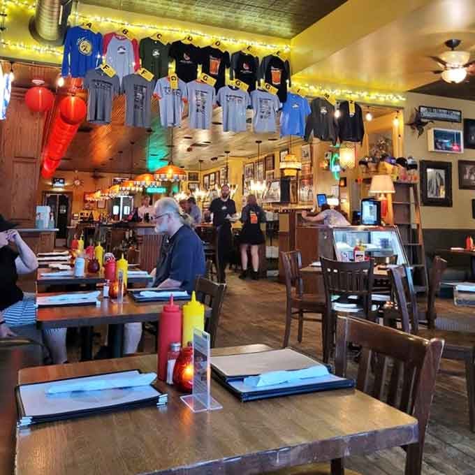 Sports jerseys hanging overhead like a Hall of Fame ceiling while diners feast below on pure Wisconsin comfort.