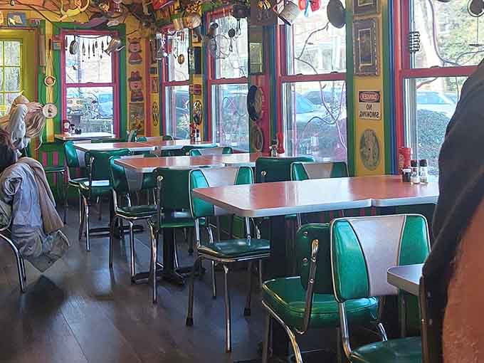 Retro green chairs meet ceiling chaos in the most delightfully overwhelming breakfast setting imaginable.