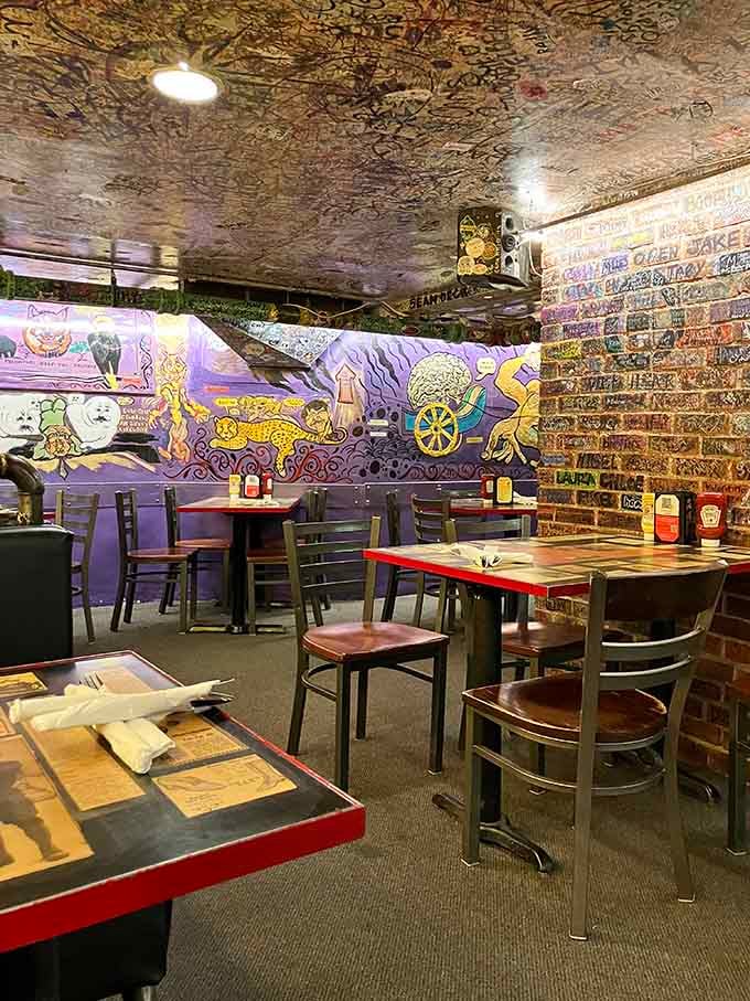 Graffiti-covered ceilings and vibrant murals create an atmosphere that's part art gallery, part time capsule of Boulder history.