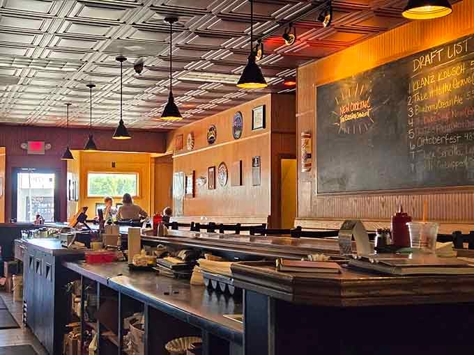 Industrial chic meets neighborhood hangout, where exposed ceilings and warm wood create the perfect burger-eating atmosphere.